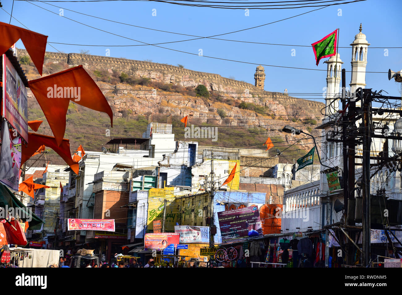 Street scene and Chittor Fort and mosque, Chittorgarh, Rajasthan, India ...
