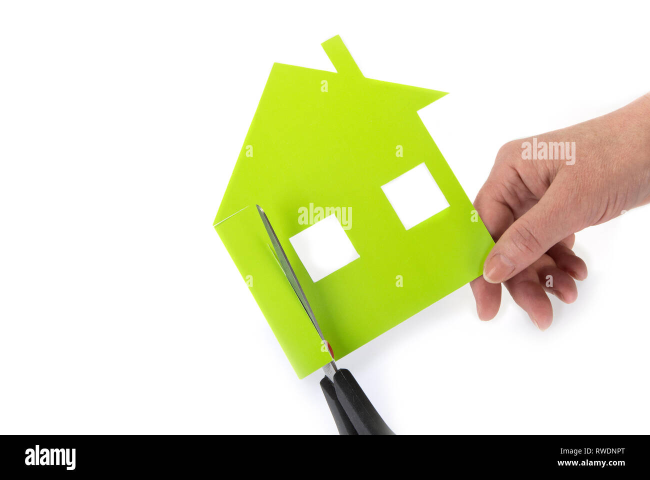 Cut out house from paper. To own a house concept Stock Photo - Alamy