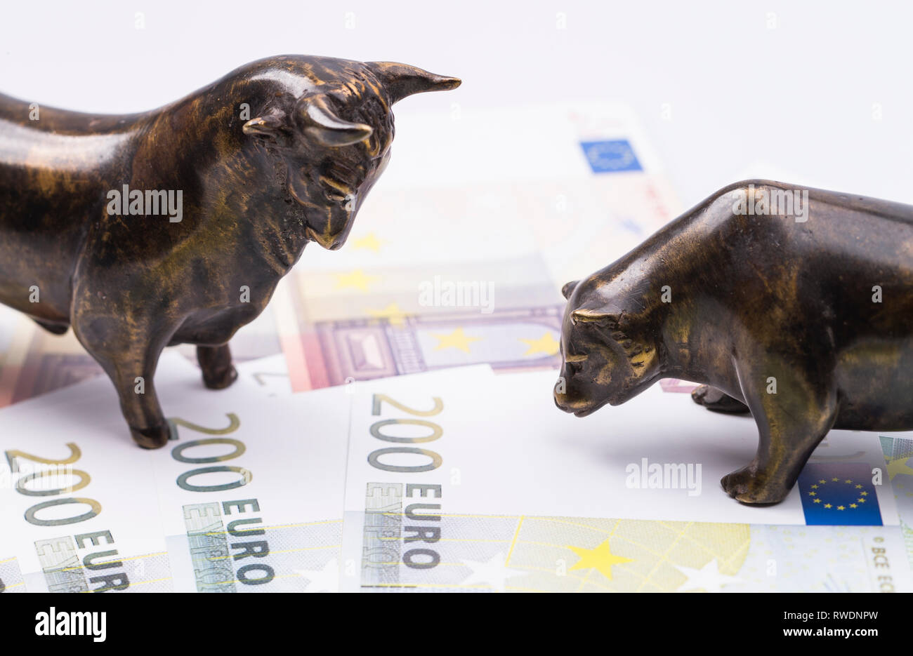 The photo shows a bull and a bear standing on a few bank notes Stock ...