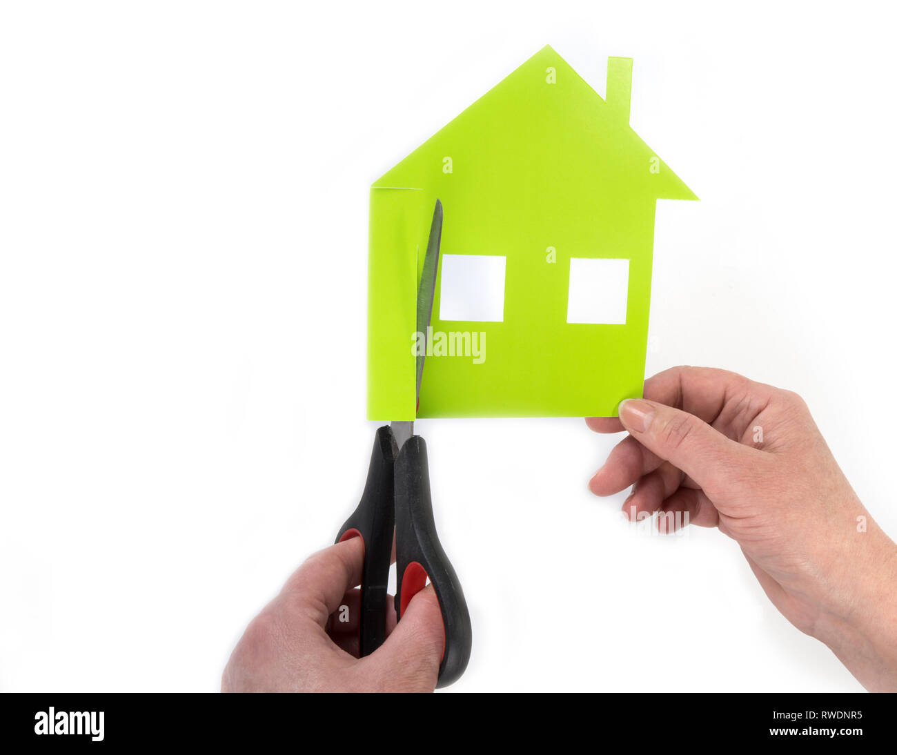 Cut out house from paper. To own a house concept Stock Photo - Alamy