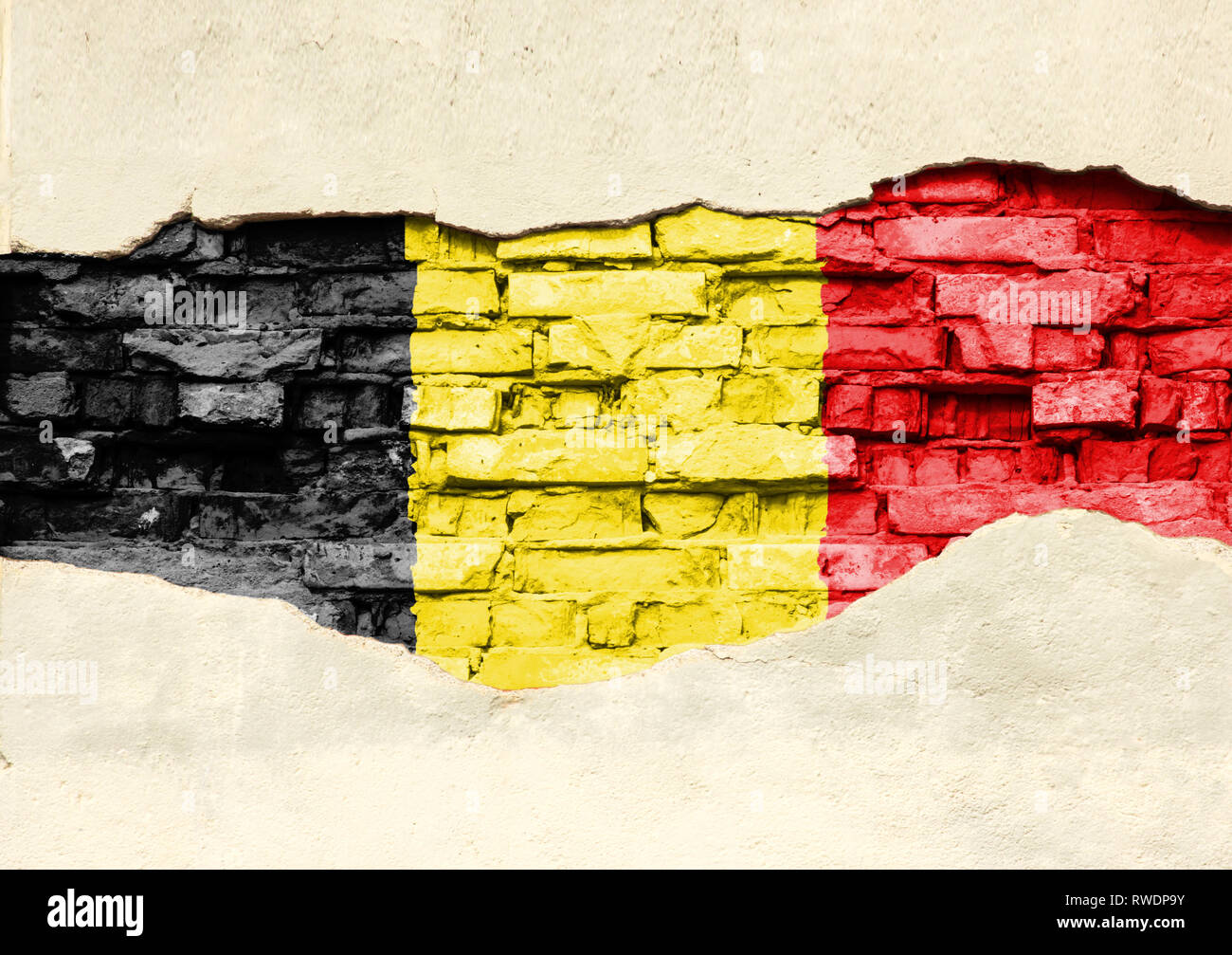 National flag of Belgium on a brick background. Brick wall with ...