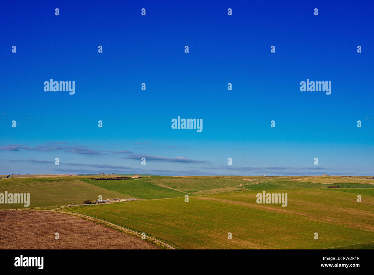 Light blue sky with light clouds green hills hi-res stock photography ...