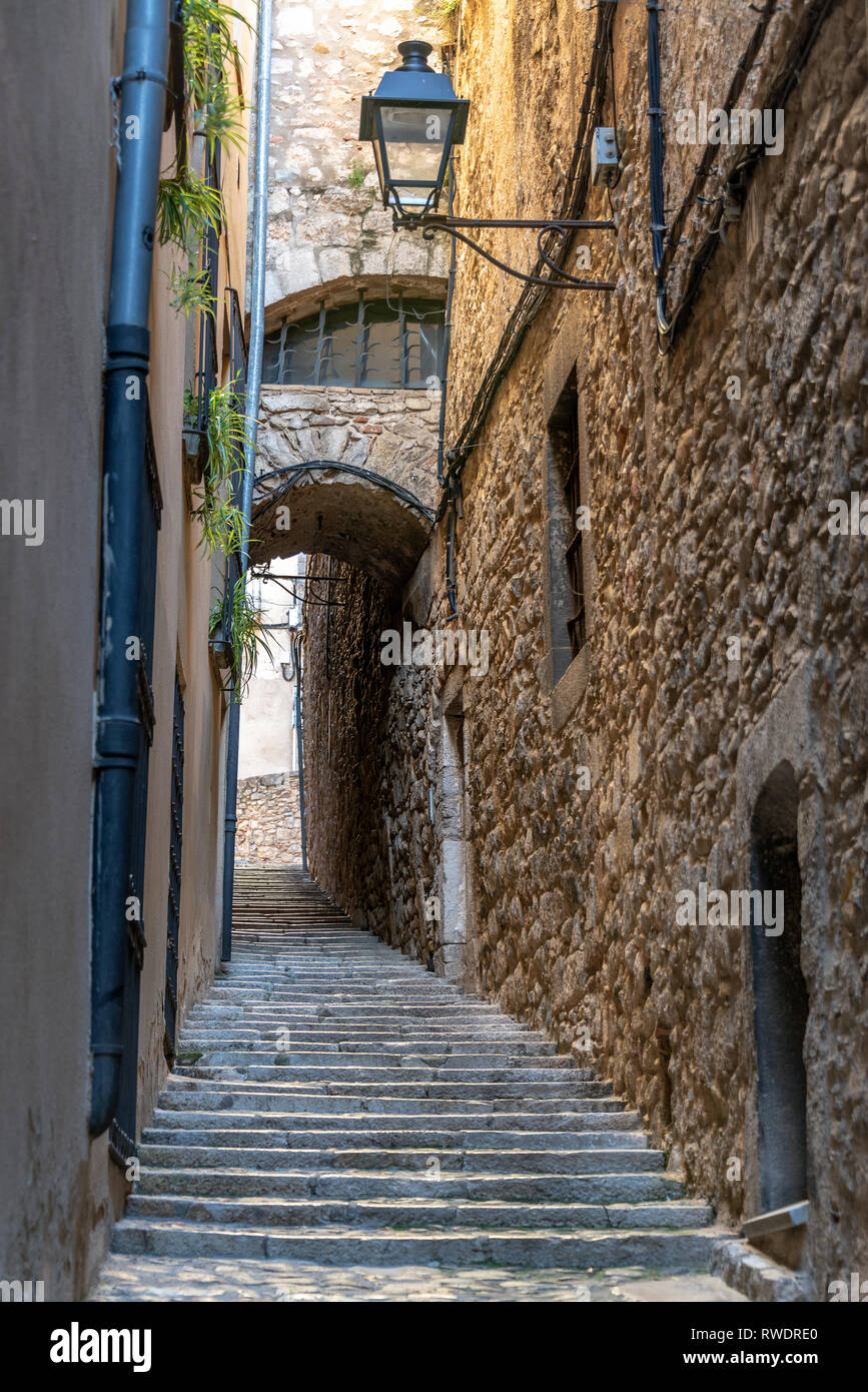 Vertical view of an old medieval alley in Girona, Spain Stock Photo - Alamy