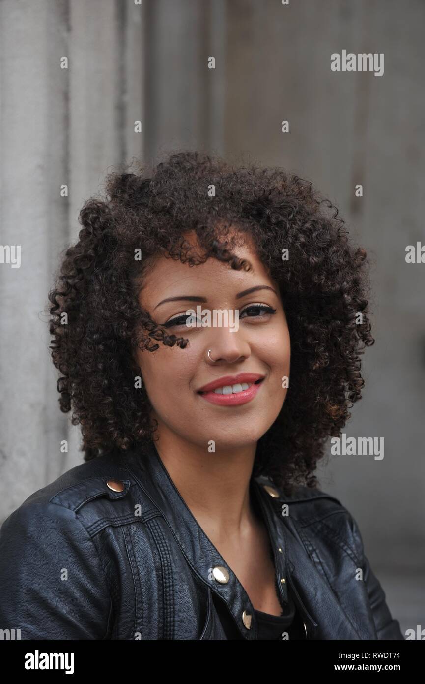 Head shots, portraits of beautiful young mixed race woman using natural ...