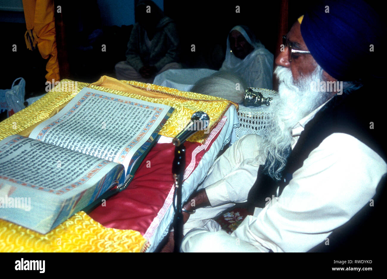 The Guru Granth Sahib, the living guru for Sikhs, is read continuously ...