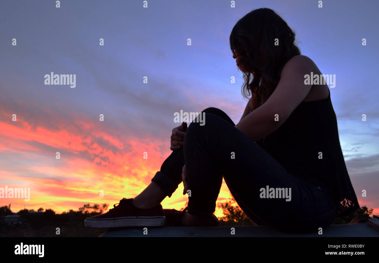girl at sunset Stock Photo - Alamy