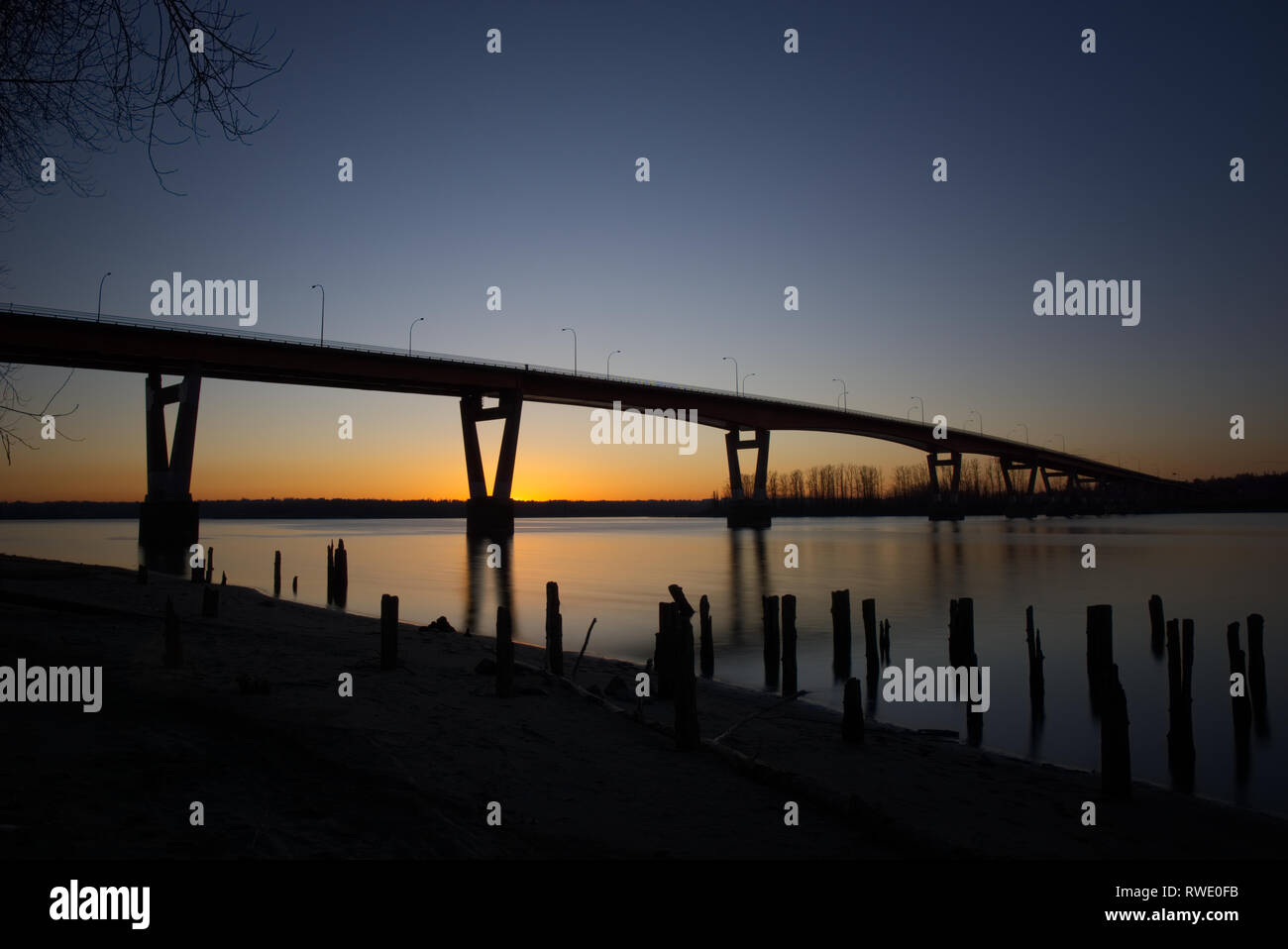 Sunset behind a bridge Stock Photo - Alamy