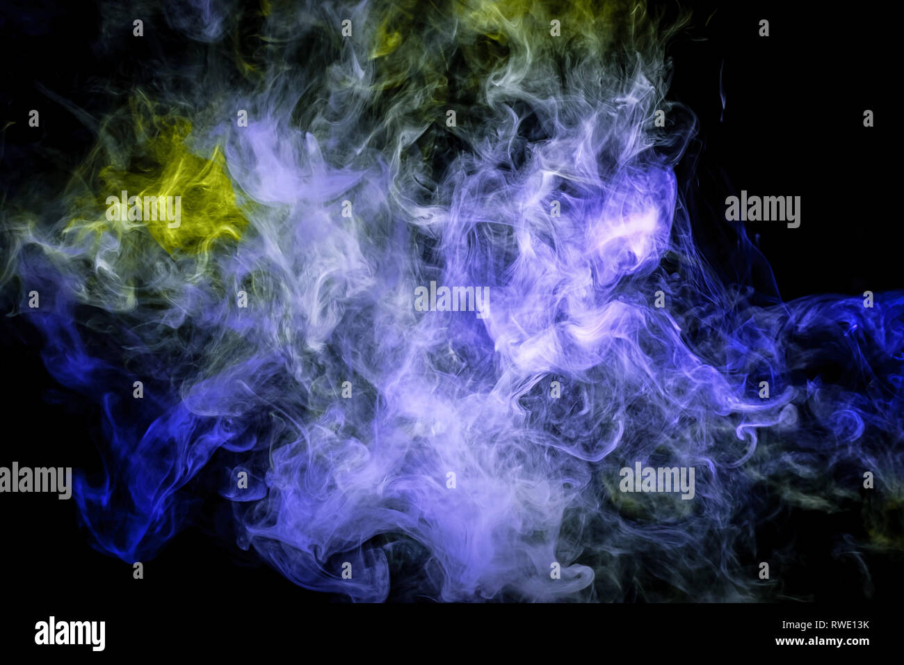 Abstract art blue and green colored smoke on black isolated background ...