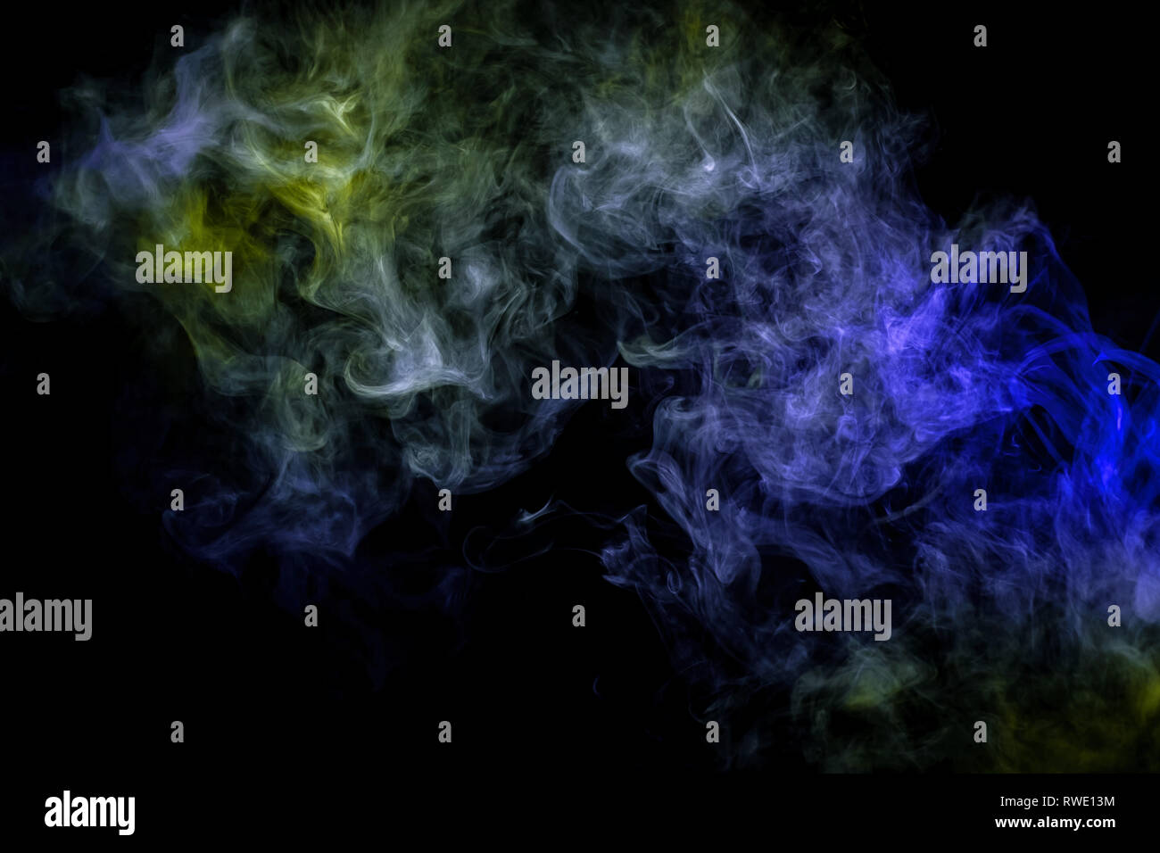 Frozen abstract movement of explosion smoke multiple colors green and ...