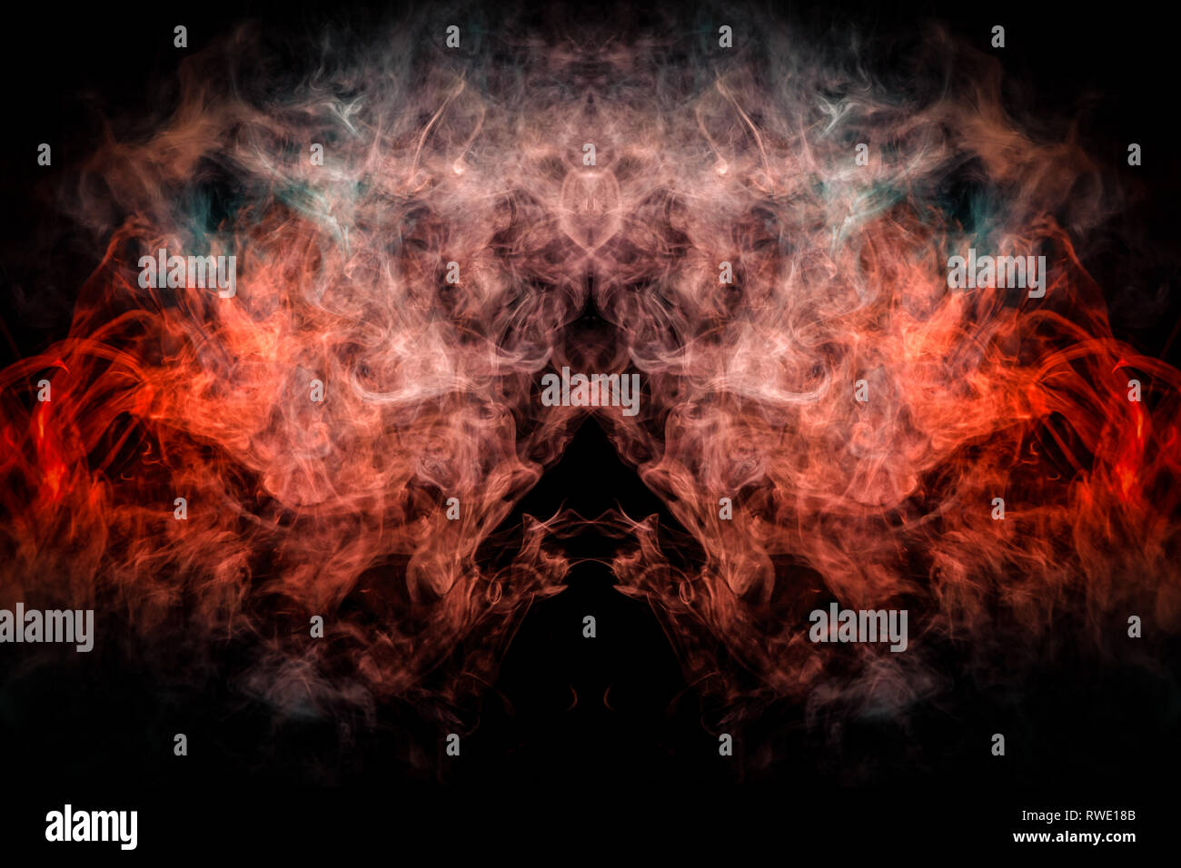 Thick colorful smoke of blue and red in the form of a skull, monster ...