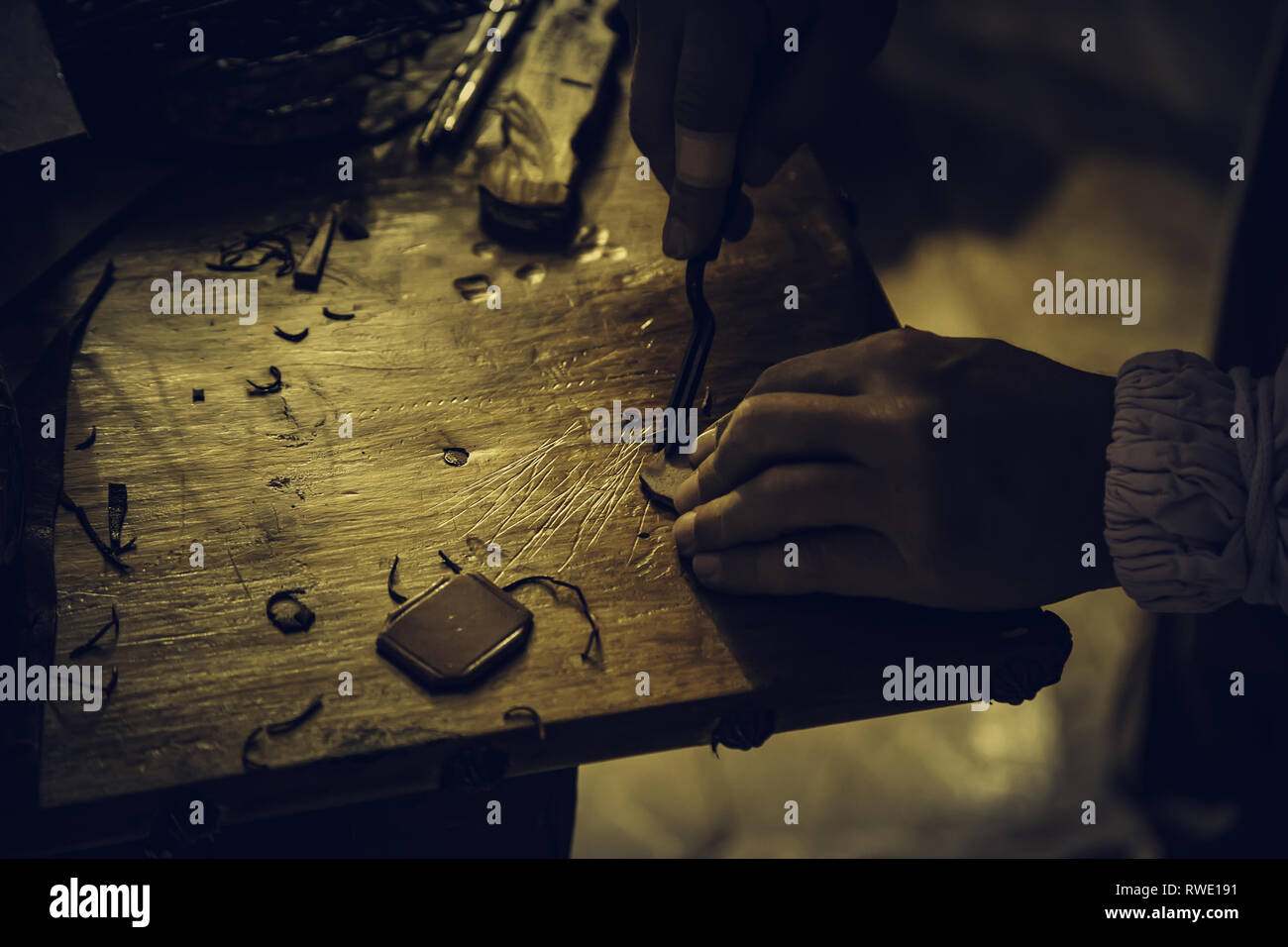 Person working with leather in traditional way, artisan work detail ...