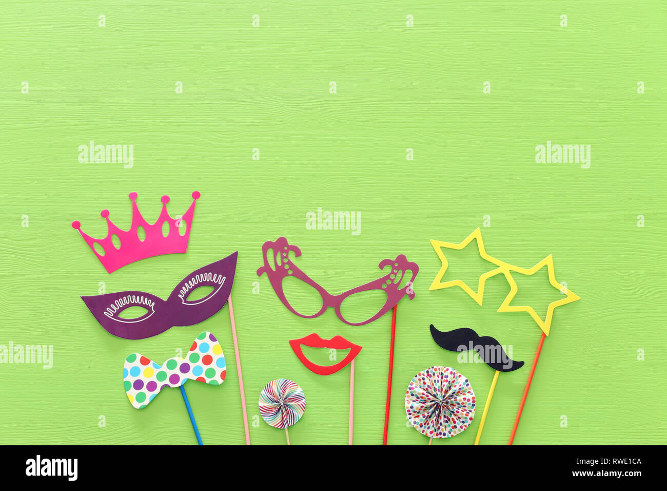 carnival party celebration concept with paper photo booth props over ...