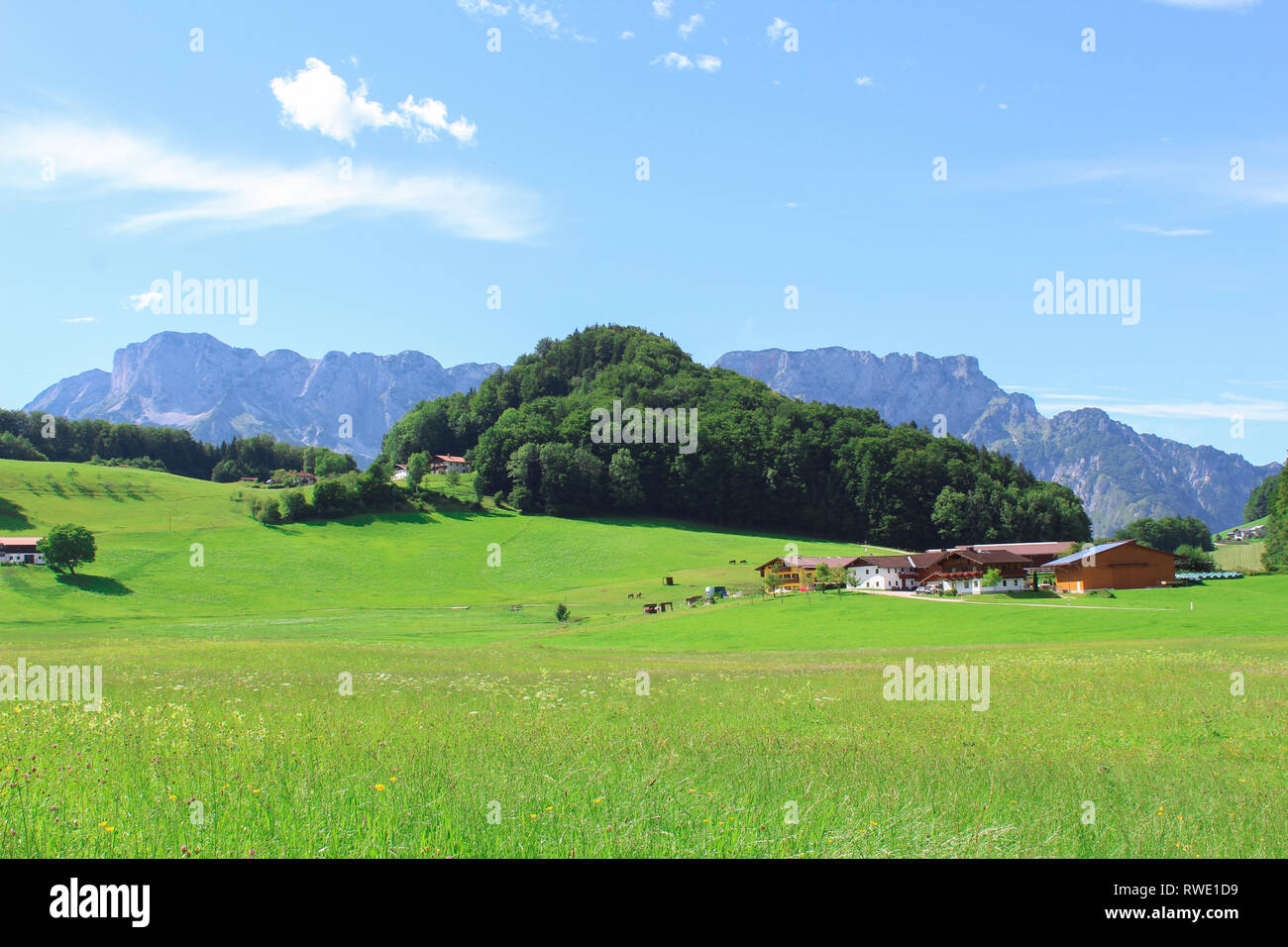 the alps behind a farm Stock Photo - Alamy