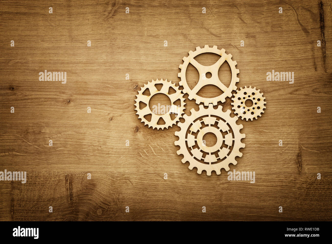 hand placing a cogwheel in set of gears mechanism Stock Photo - Alamy