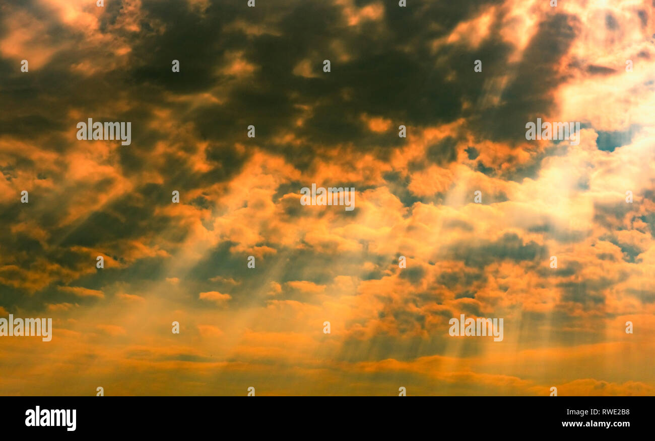 God light. Dramatic dark cloudy sky with sun beam. Yellow sun rays ...