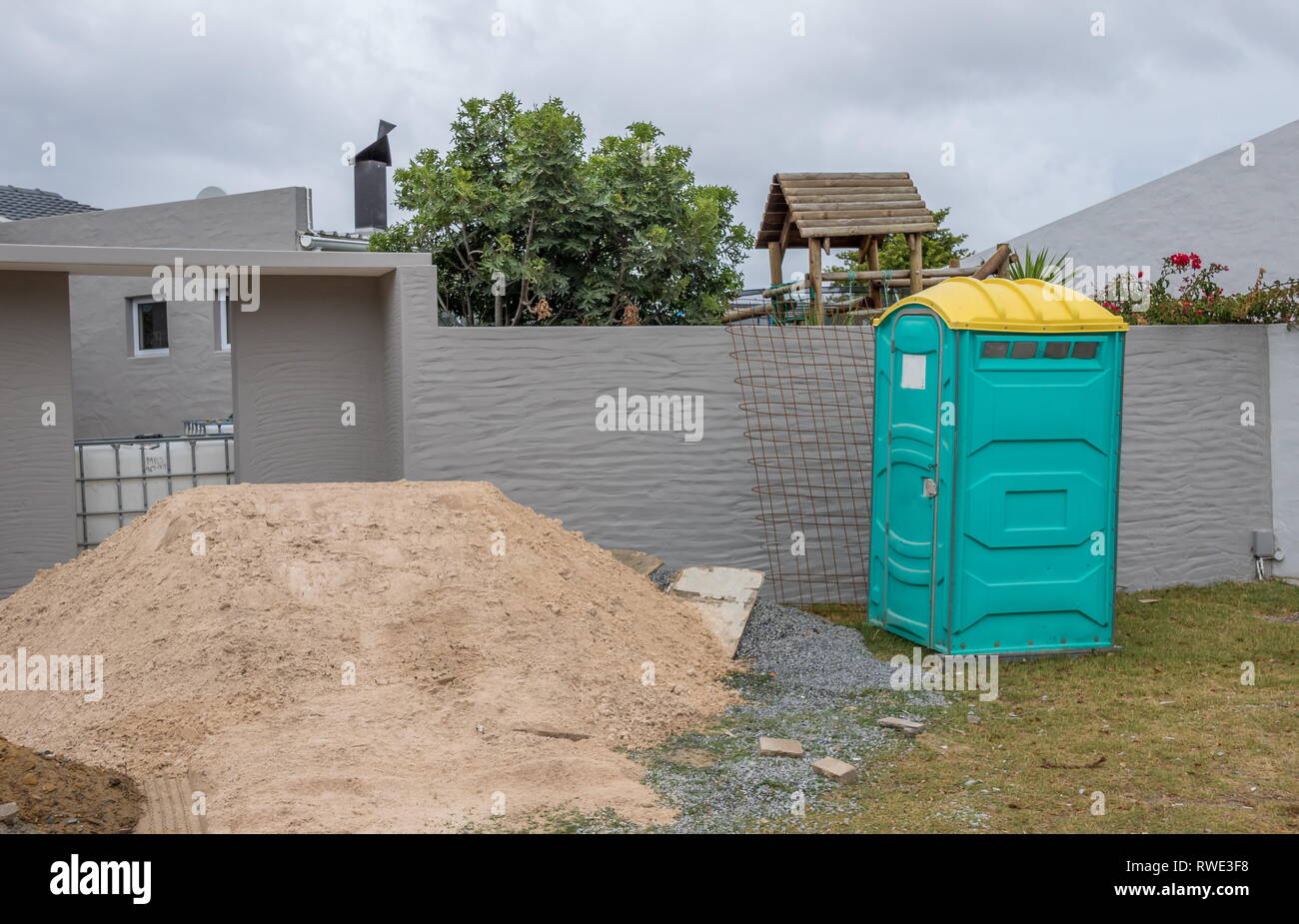 A portable toilet on a building site image with copy space in landscape ...
