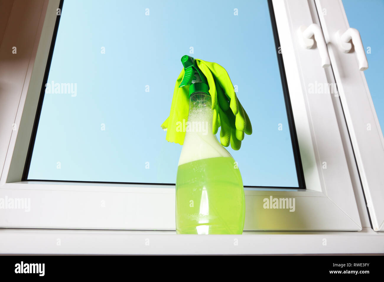 Cleaning window using tools - rag and spray detergent. Spring cleaning ...