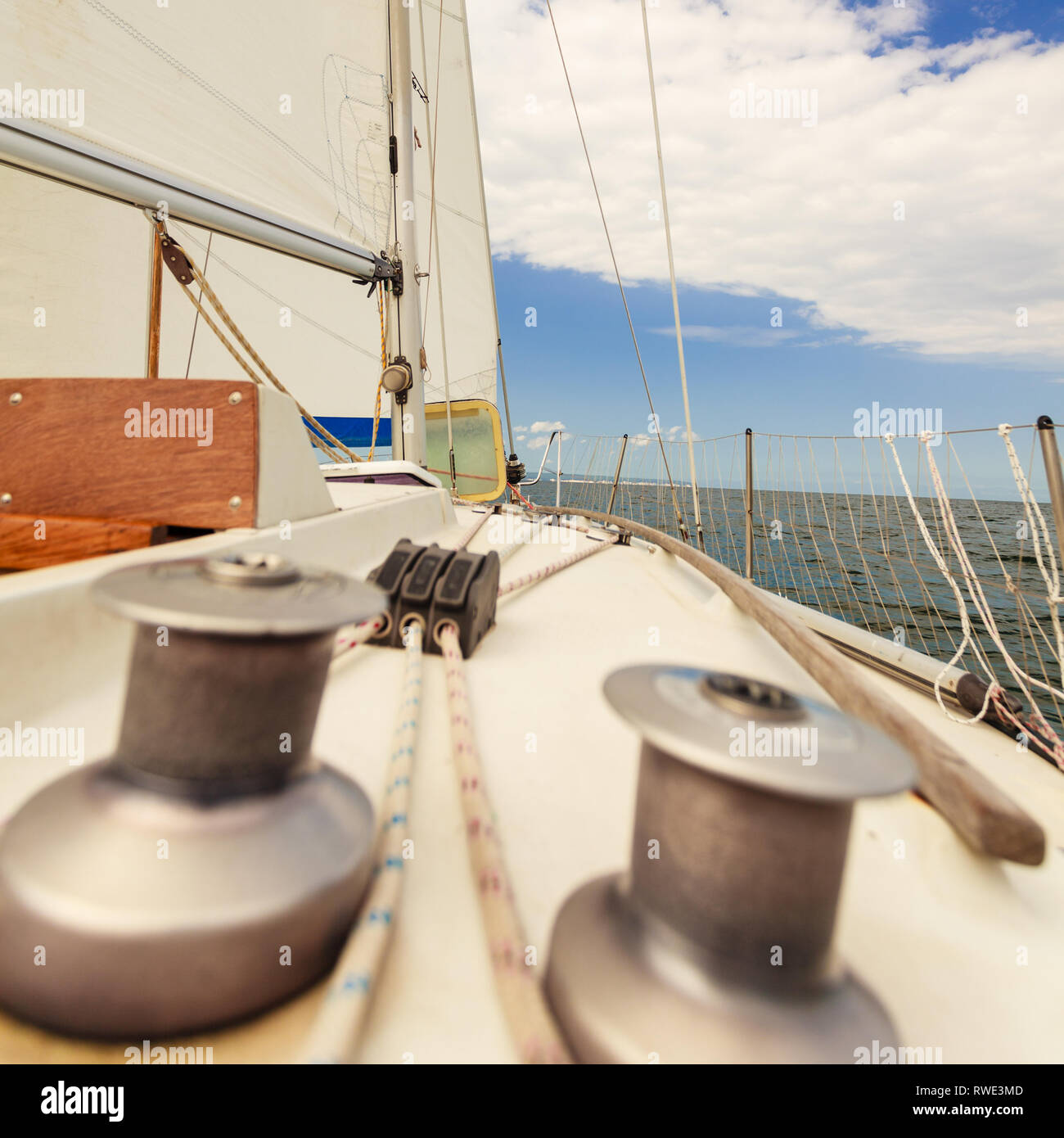 Yacht capstan with rope on sailing boat during cruise, marine objects ...