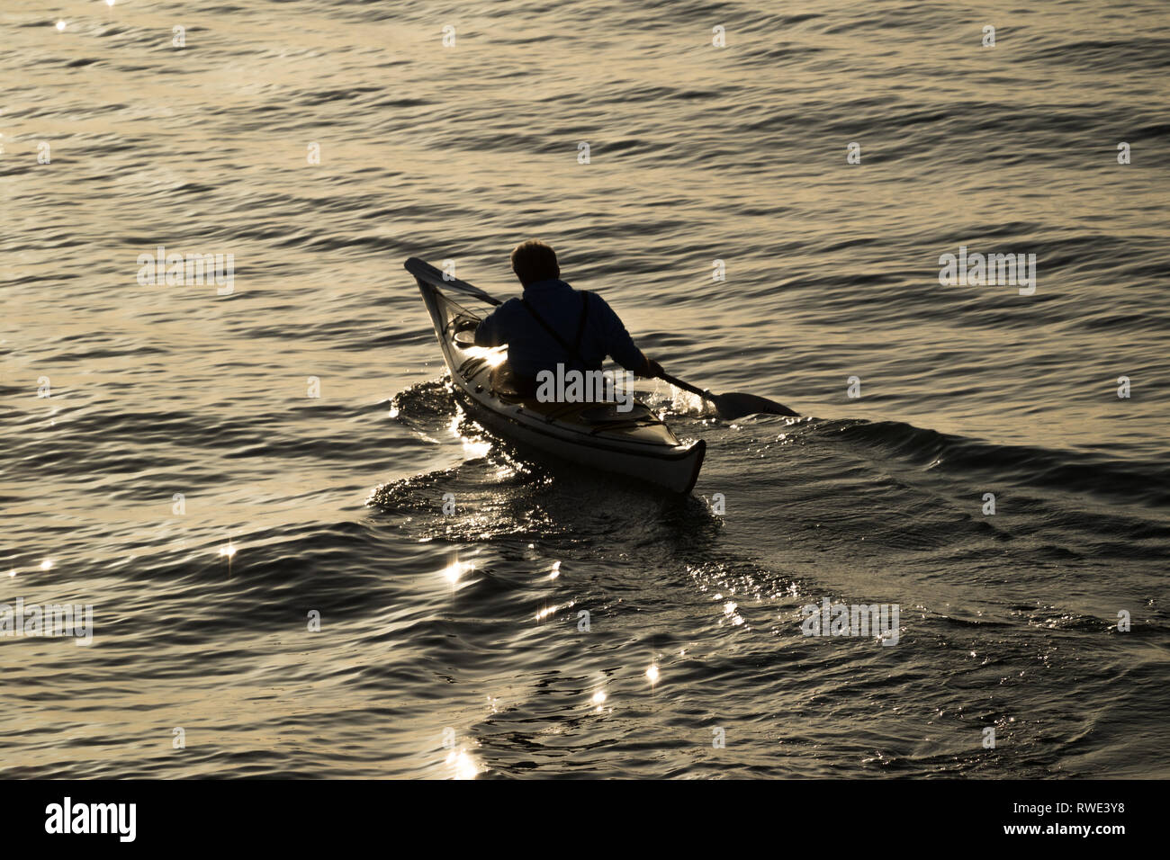 Man floating water silhouette hi-res stock photography and images - Alamy