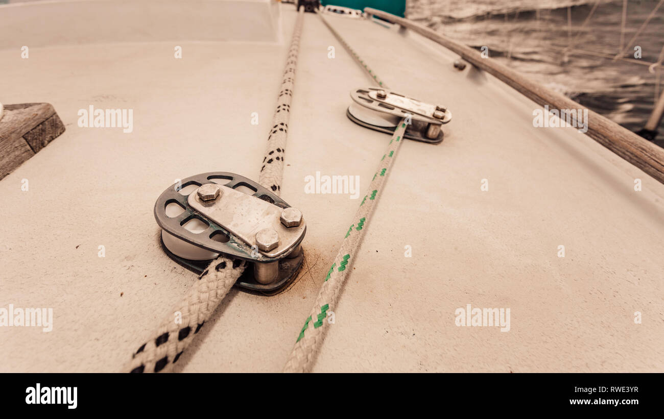 Detailed close up of rope block on white sail boat. Yachting objects ...