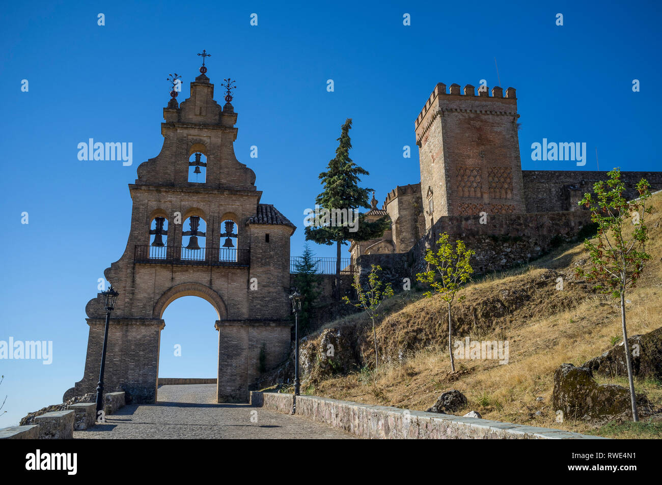 The dramatic gateway / belltower entrance to Aracena Castle, Aracena ...