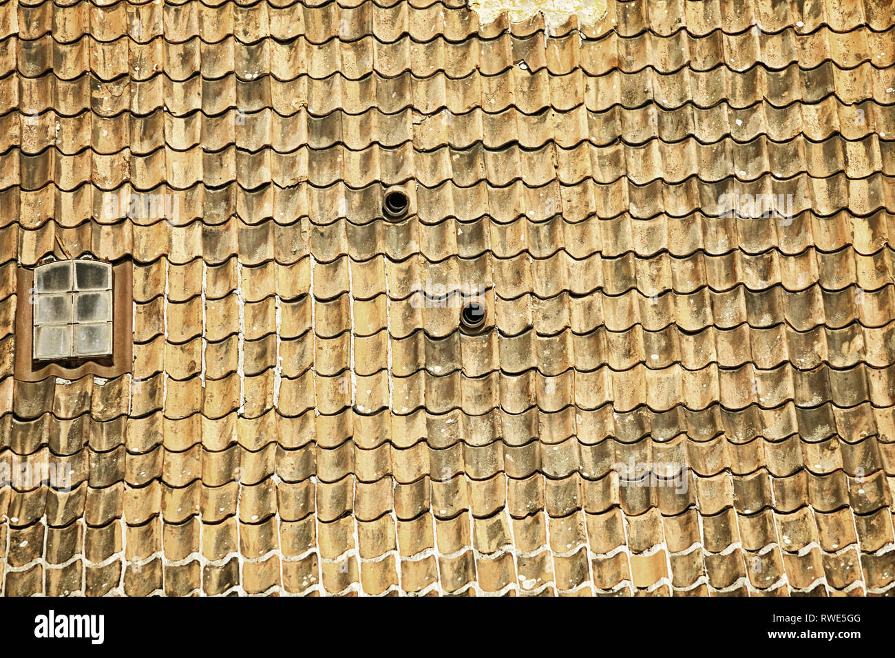 old clay roof with window tile background Stock Photo - Alamy