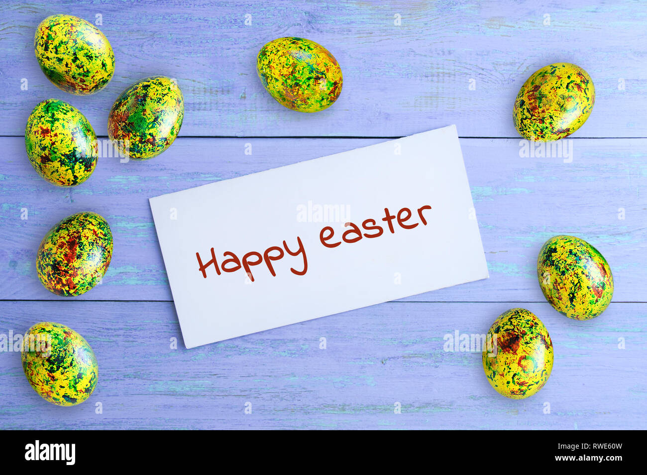 Concept Happy easter. Painted eggs and white otkrka with the ...