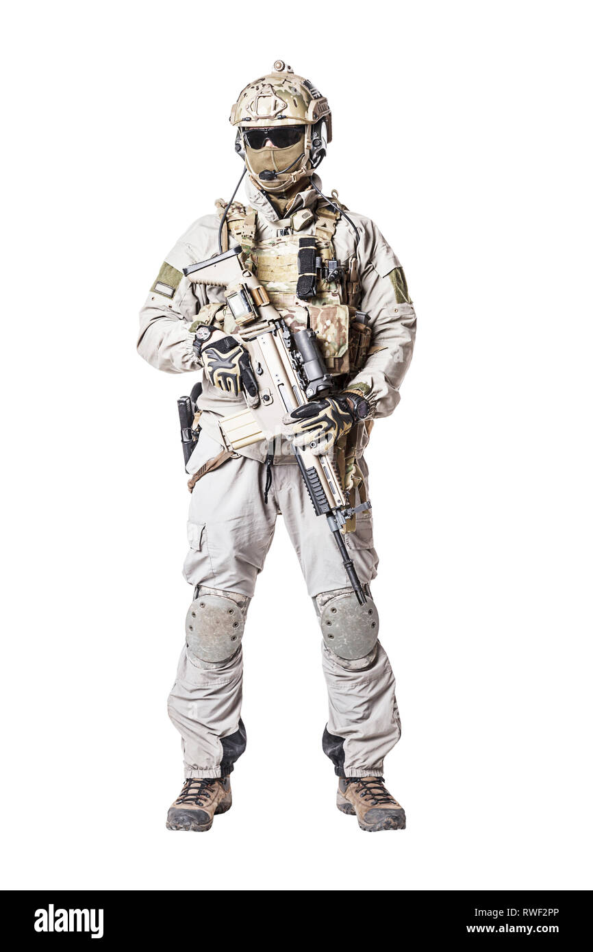 Army soldier in Protective Combat Uniform holding assault rifle Stock ...