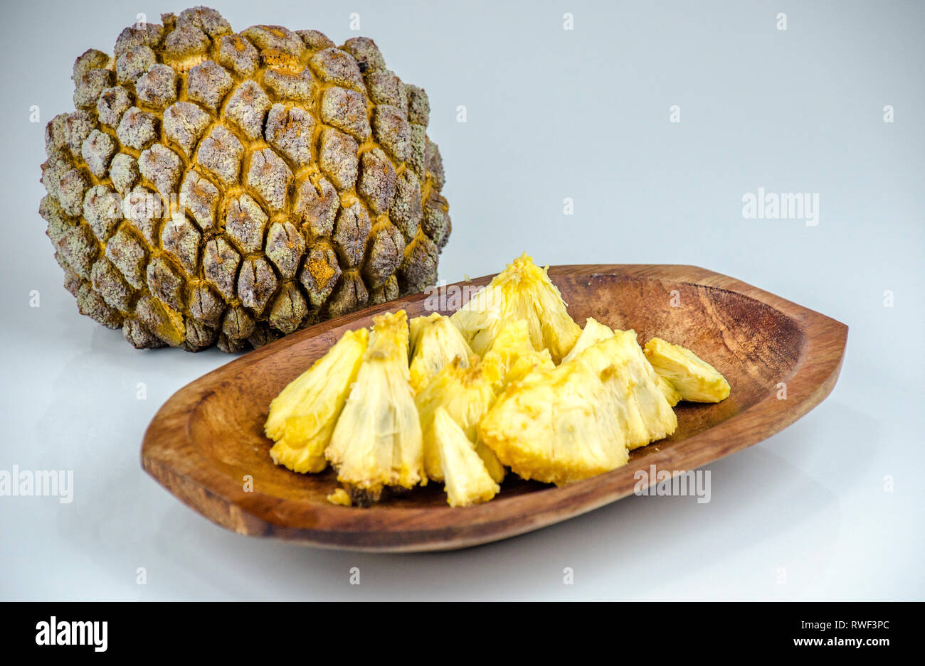 Edible part of marolo, araticum or bruto fruit on wooden bowl ...