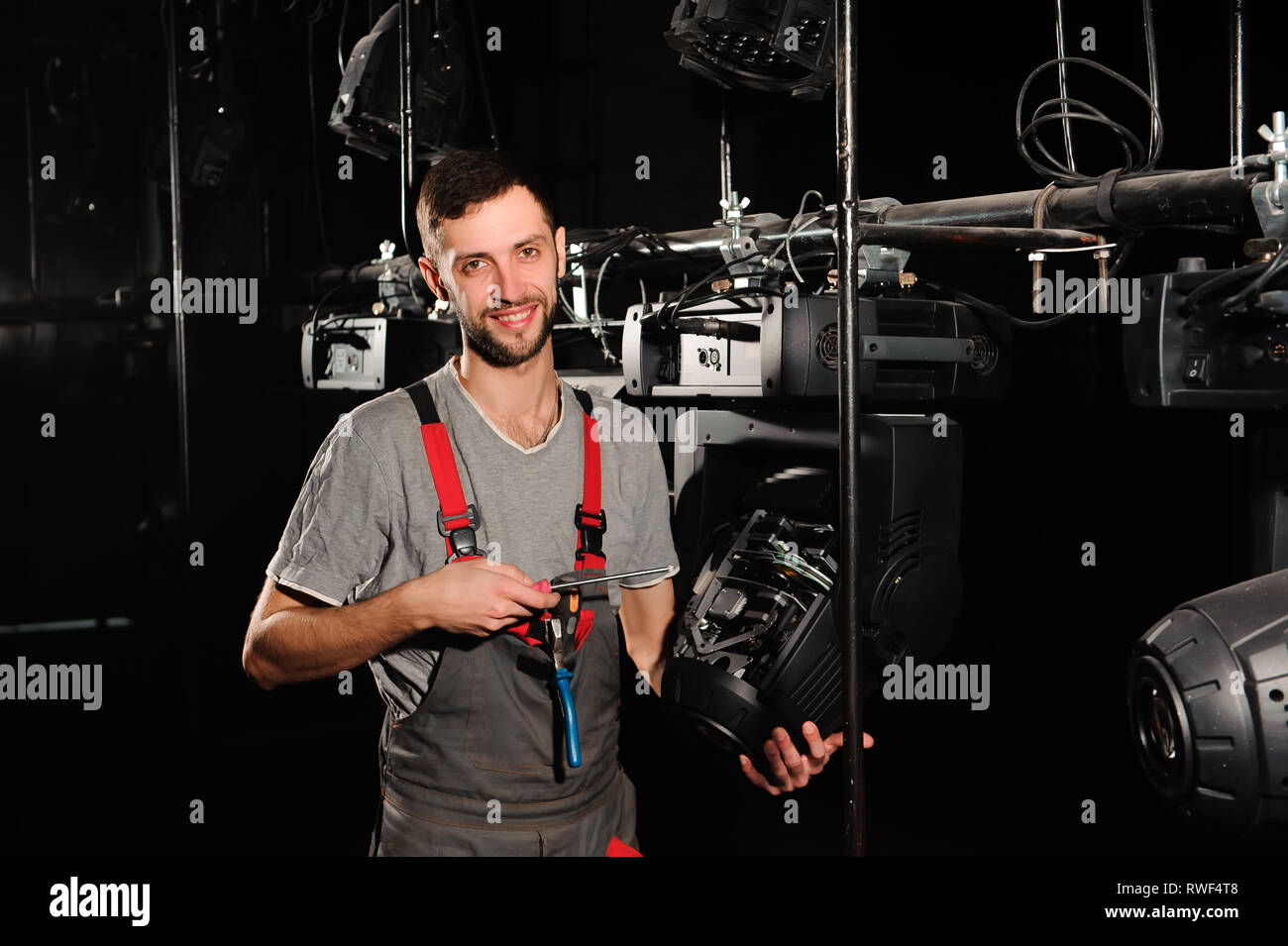 The lighting engineer adjusts the lights on the stage Stock Photo - Alamy