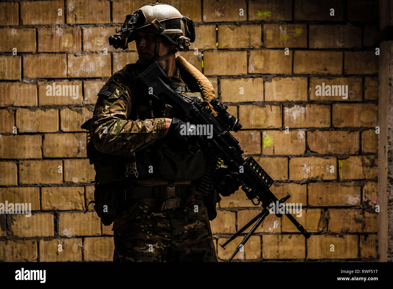 U.S. Army Ranger with machine gun and night vision goggles, standing ...