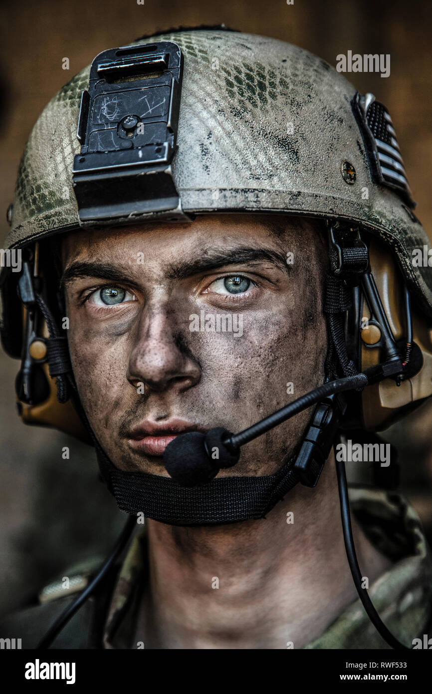 Close-up portrait of a young U.S. Army Ranger wearing combat helmt ...