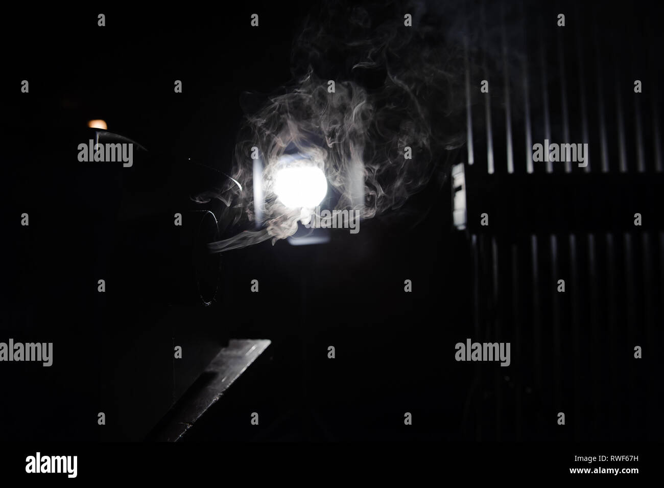 lights in smoke, studio lights shining through the smoke from smoke ...