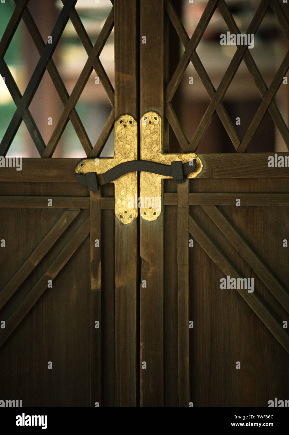 A Japanese gold wooden door latch system detail background Stock Photo ...