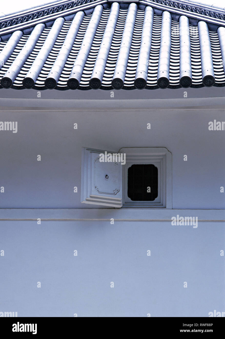 a small Japanese window details with blue tiled roof Stock Photo - Alamy