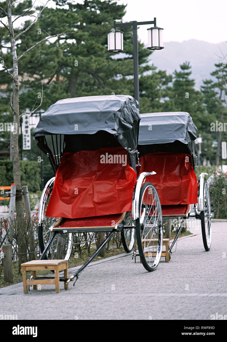 Japanese old and traditional tourist red and black rickshaw Stock Photo ...