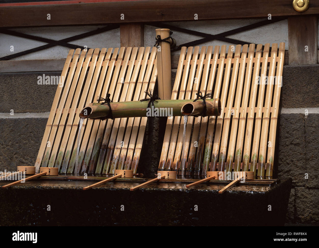 Japanese bamboo drinking water system with water flowing background ...