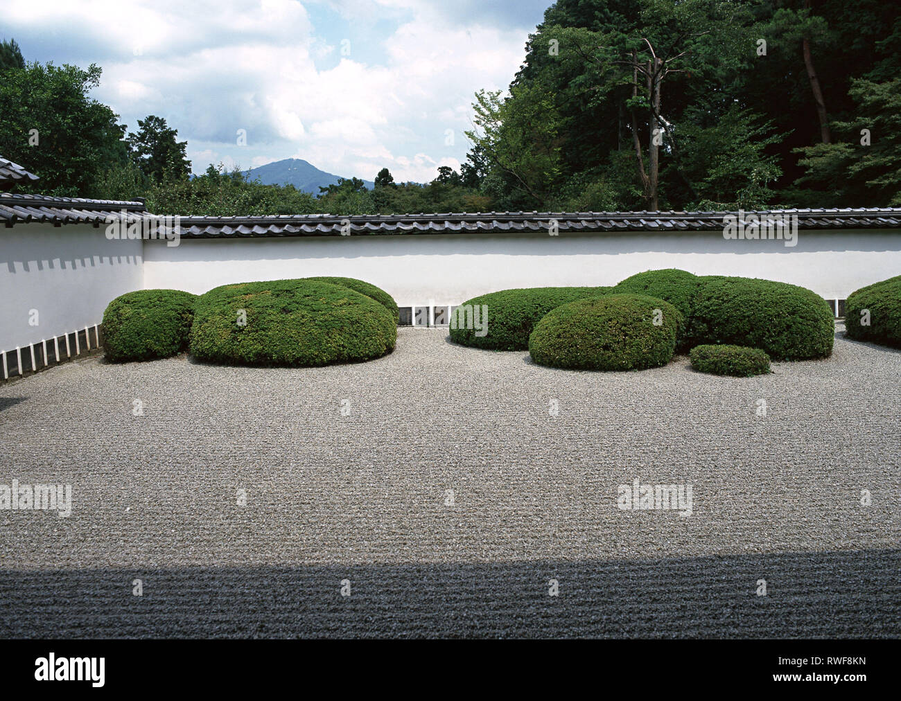 Japanese traditional vintage outdoor garden pathway with green bushes ...