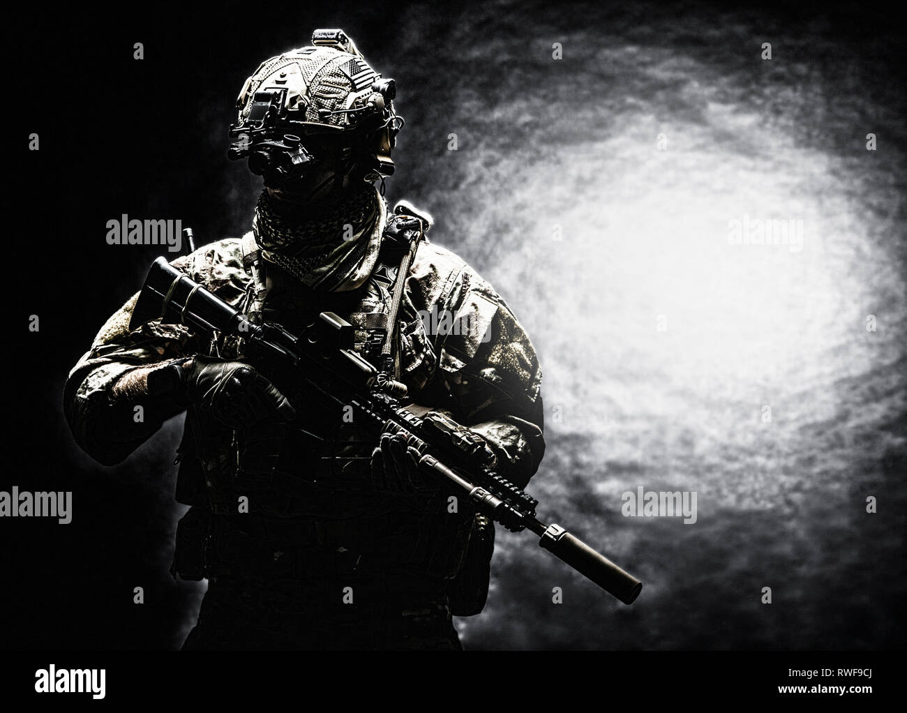 Army soldier in combat uniform with assault rifle, studio shot Stock ...