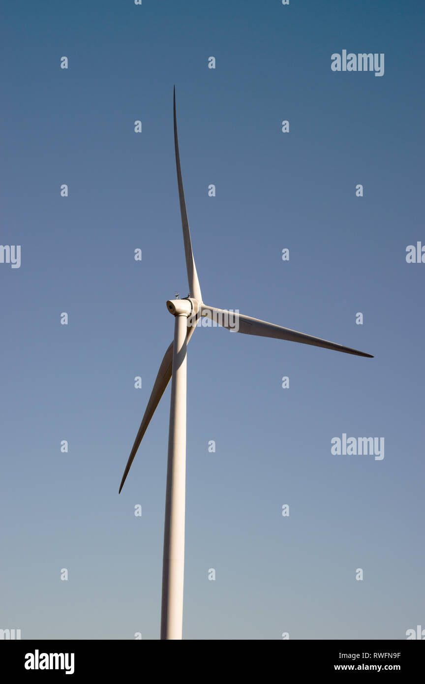 Modern windmill for electric power production with a clear blue sky ...