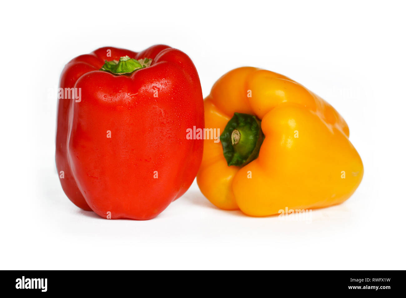 Red and yellow paprika isolated on white background Stock Photo - Alamy