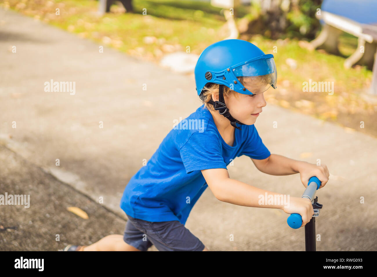 Toddler playing kick scooter hi-res stock photography and images - Alamy