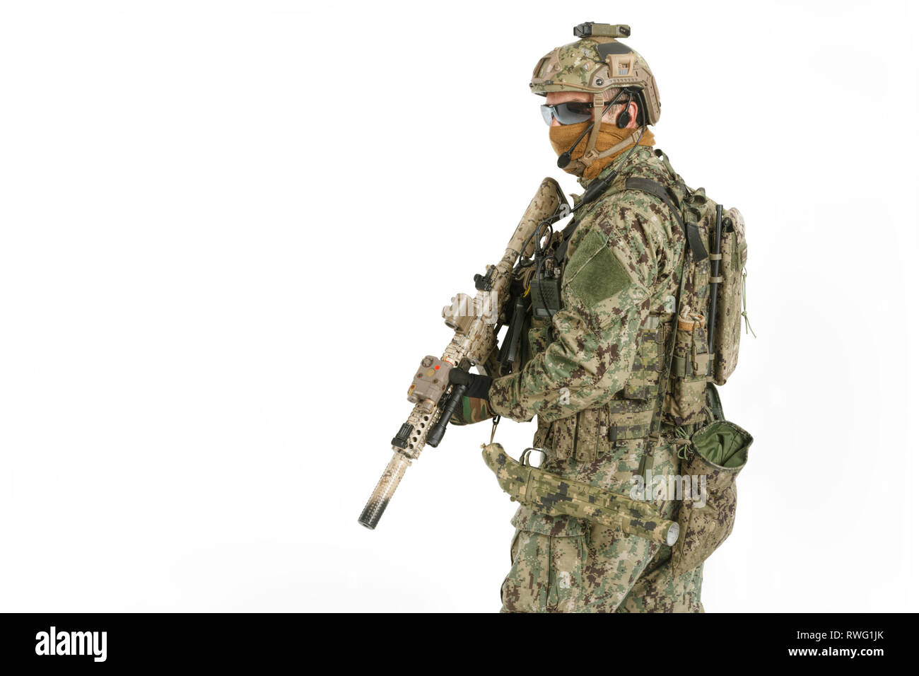 Special forces soldier in field uniform with weapon and wearing ...