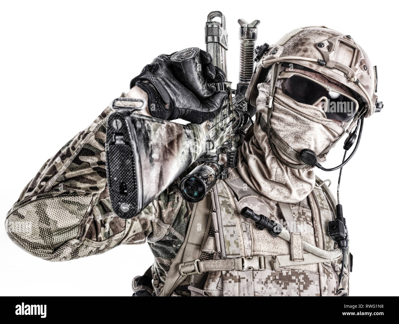 Special forces soldier in field uniform and face mask with sniper rifle ...