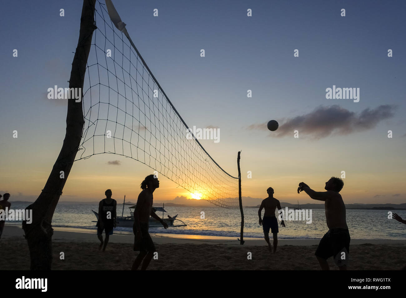 Volleyball Game and Players on General Luna Beach at Sunset - Siargao ...