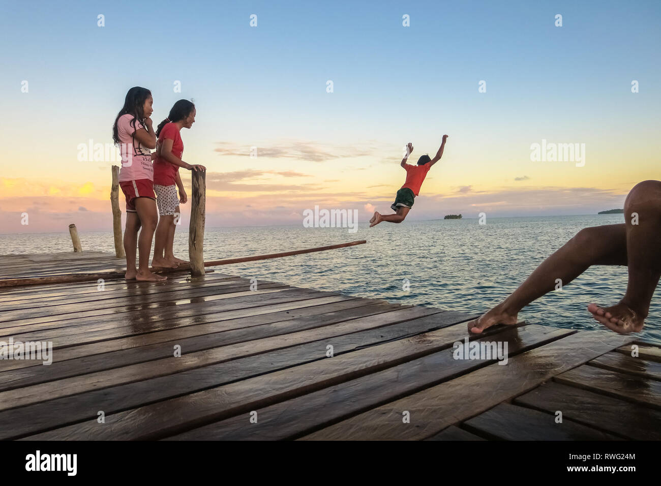 Children jumping into the sea hi-res stock photography and images - Alamy