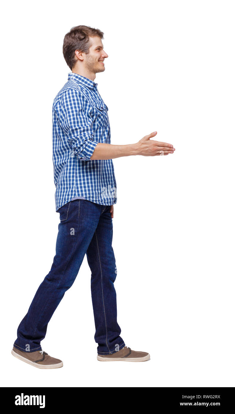 Side view of a walking businessman who stretches his hand for a ...