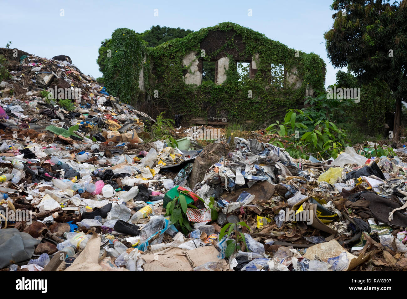 Trash piles up around a building ruin in Freetown, Sierra Leone Stock ...