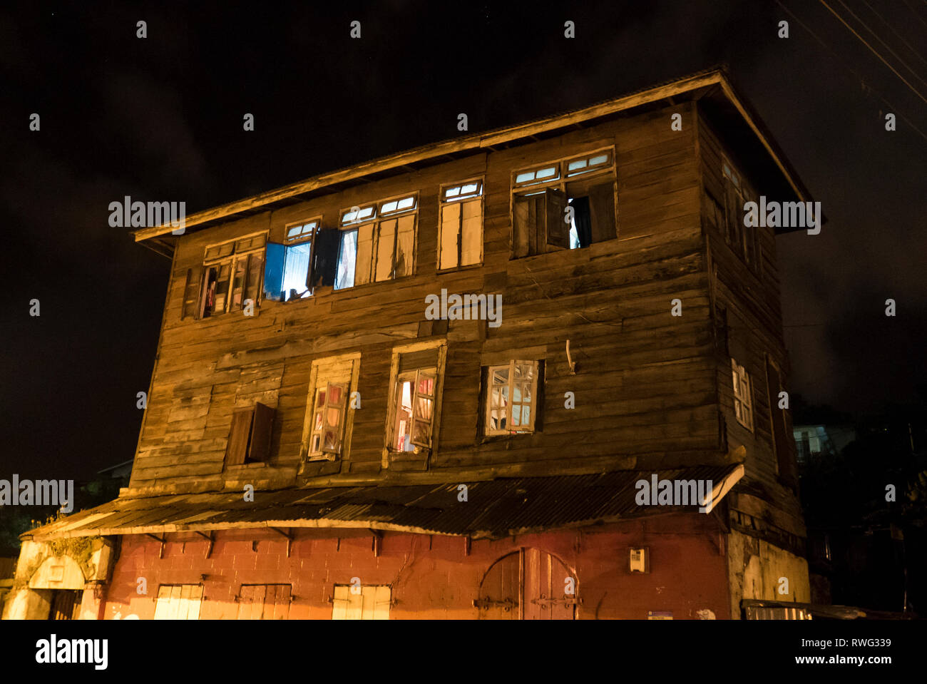 An apartment gives off an errie look at night in Freetown, Sierra Leone ...