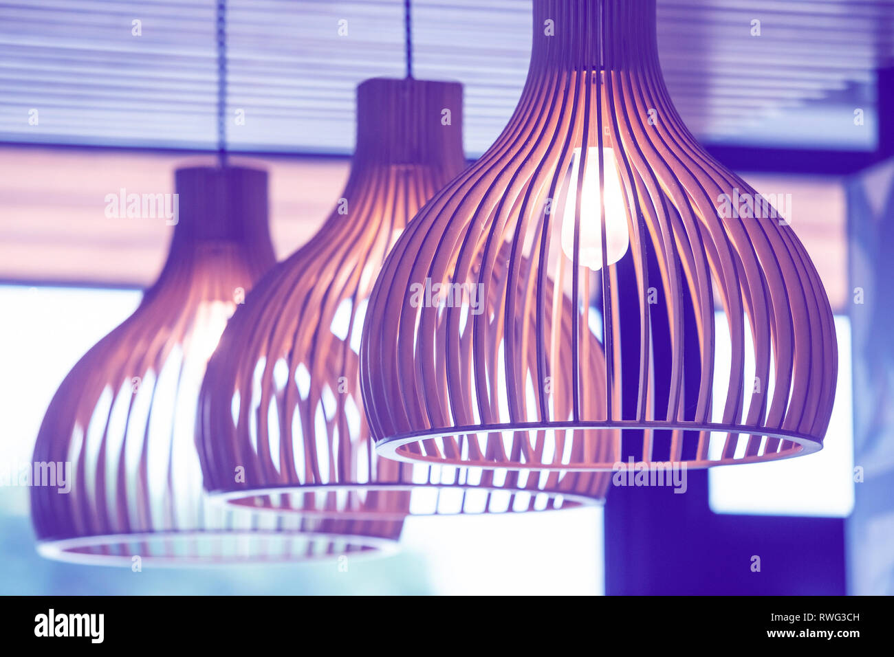 Wooden lampshades in modern interior Stock Photo - Alamy